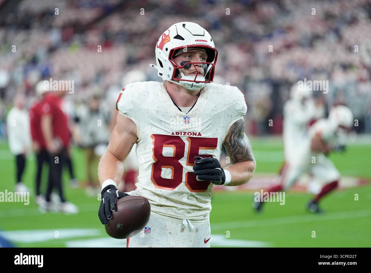Arizona Cardinals tight end Trey McBride (85) warms up before an NFL ...