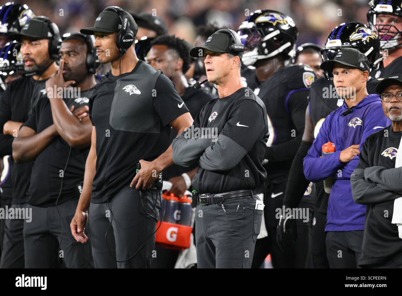 Baltimore Ravens head coach John Harbaugh, center, looks on during the ...