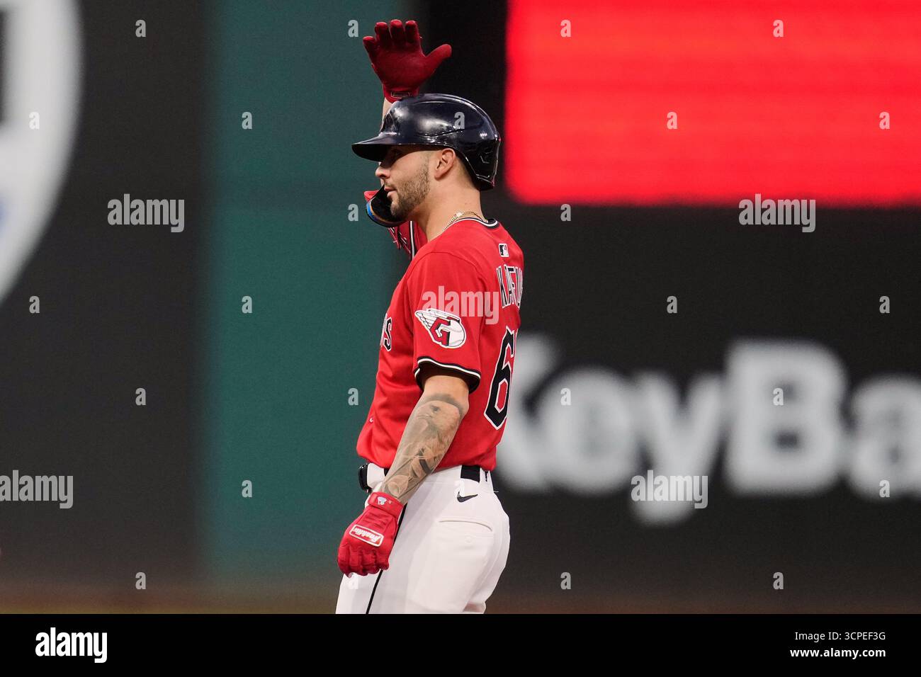 Cleveland Guardians' CJ Kayfus gestures from second base after hitting ...