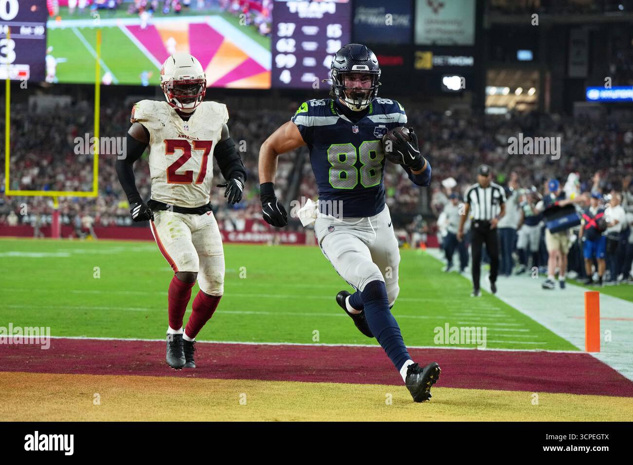 Seattle Seahawks tight end AJ Barner, right, scores past Arizona ...