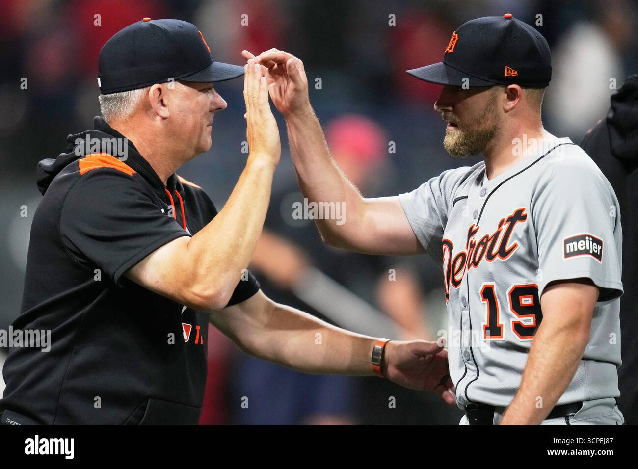 Detroit Tigers manager A.J. Hinch, left, greets relief pitcher Will ...