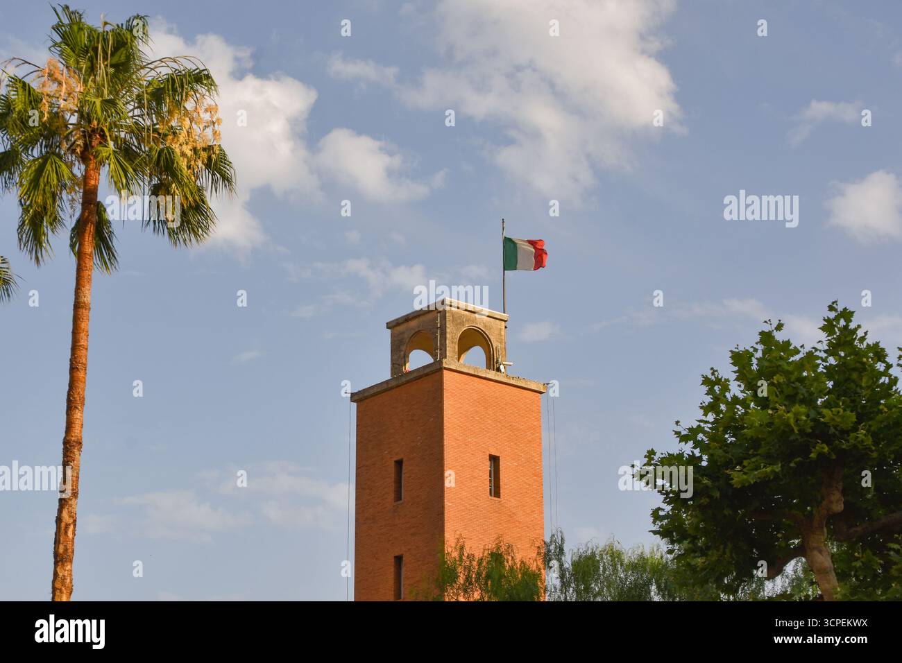 A palm tree and tower with the Italian flag near Genoa Stock Photo - Alamy