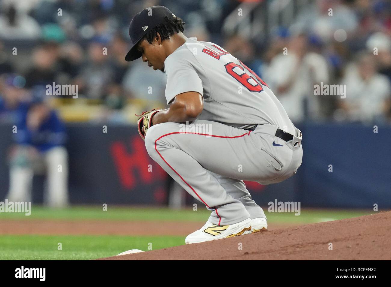 Boston Red Sox pitcher Brayan Bello (66) reacts after walking Toronto ...