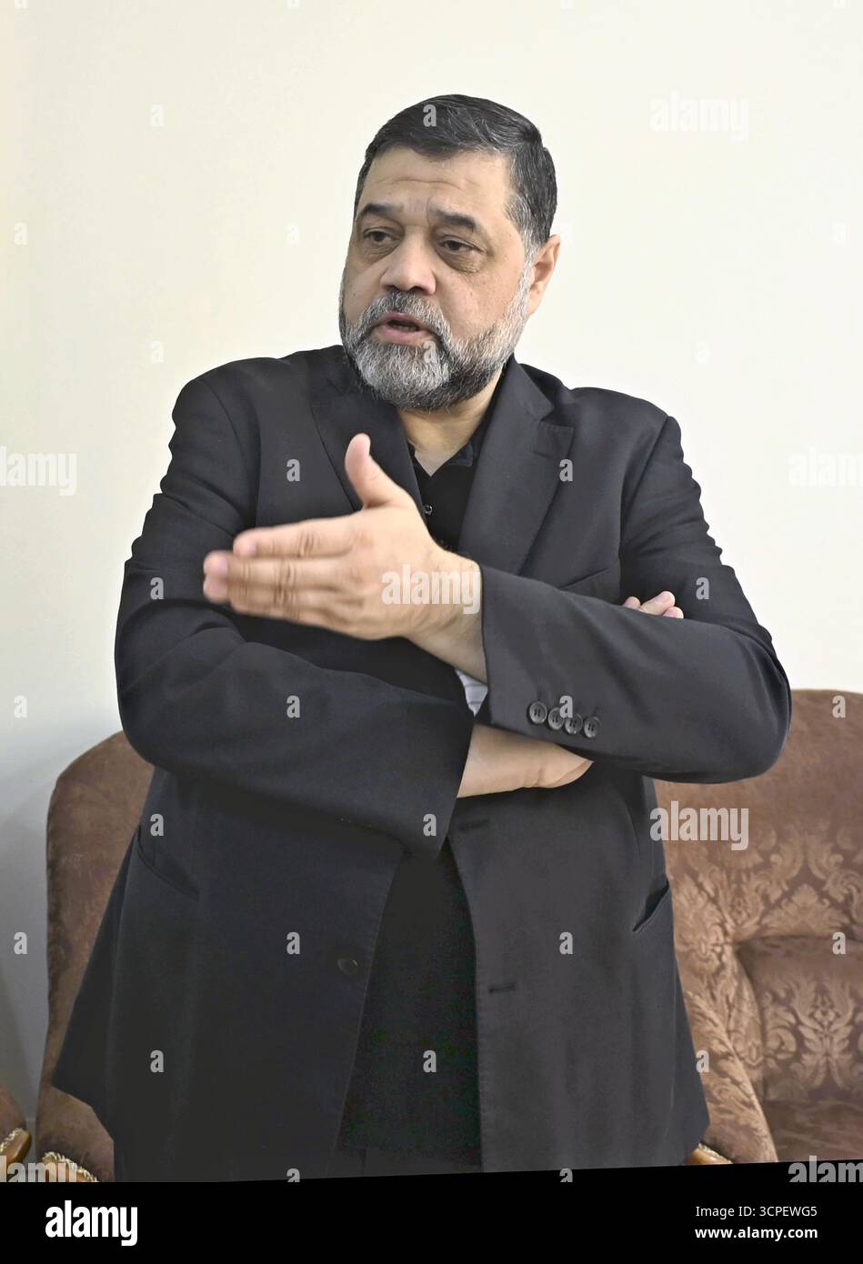 Hamas senior official Osama Hamdan speaks in an interview in Doha ...