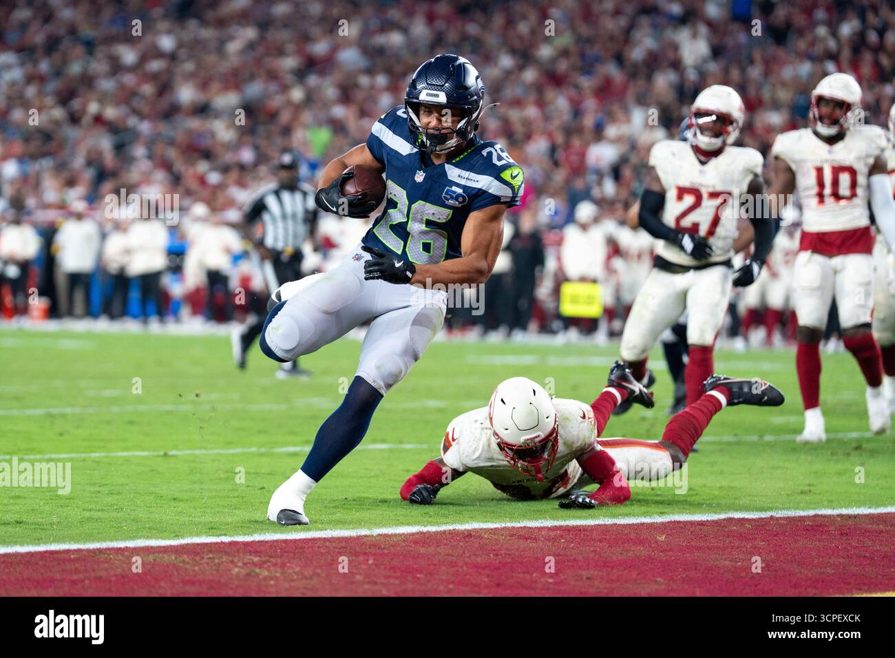 Seattle Seahawks running back Zach Charbonnet (26) runs with the ball ...