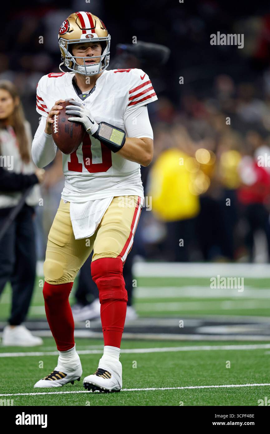 San Francisco 49ers quarterback Mac Jones (10) warms up before an NFL ...