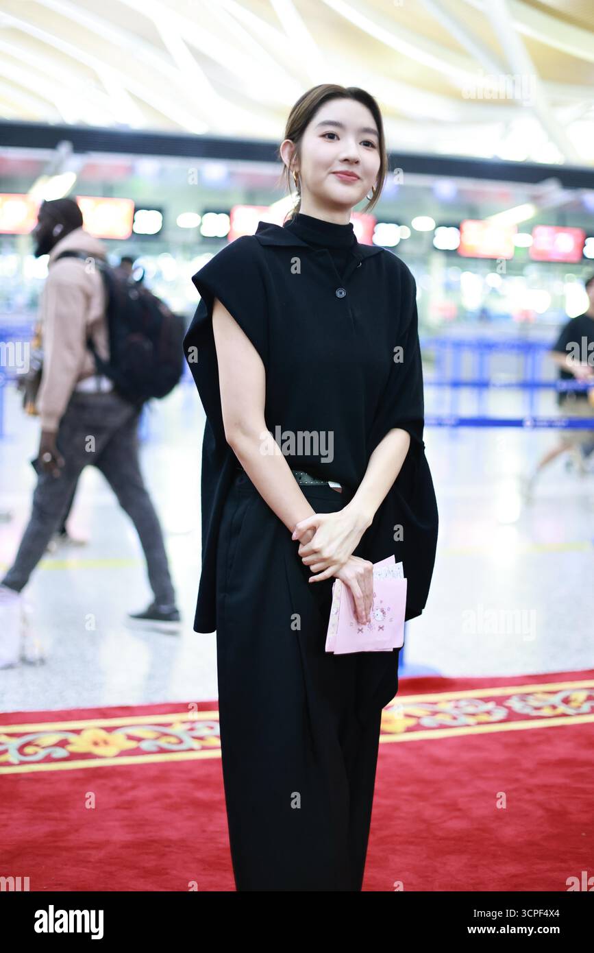 Chinese actress Wang Yuwen appears at the airport in Shanghai, China, 24 September, 2025 Stock ...