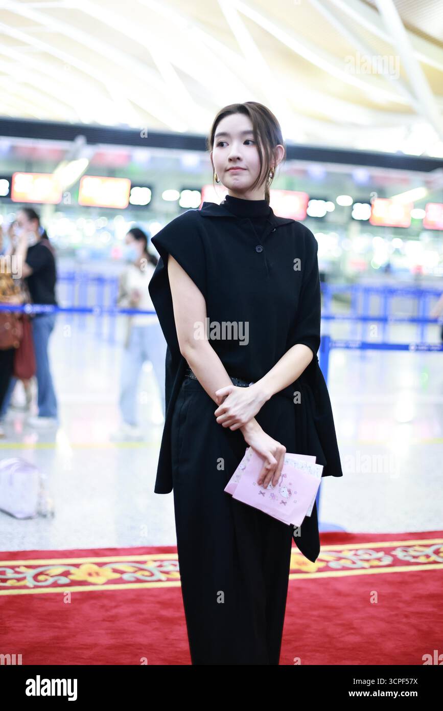 Chinese actress Wang Yuwen appears at the airport in Shanghai, China ...