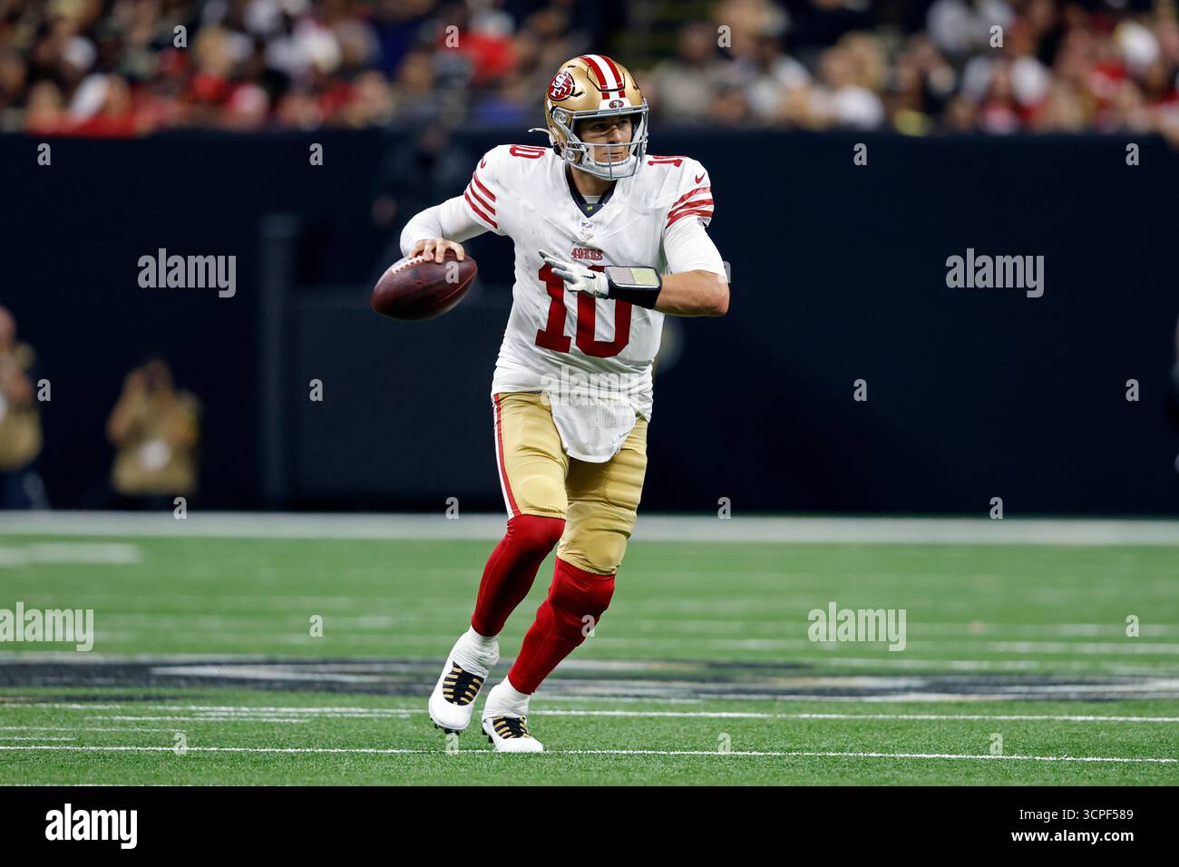 San Francisco 49ers quarterback Mac Jones (10) looks to pass during an ...