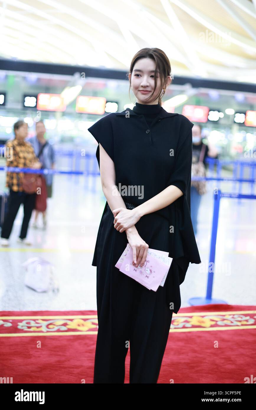 Chinese actress Wang Yuwen appears at the airport in Shanghai, China ...