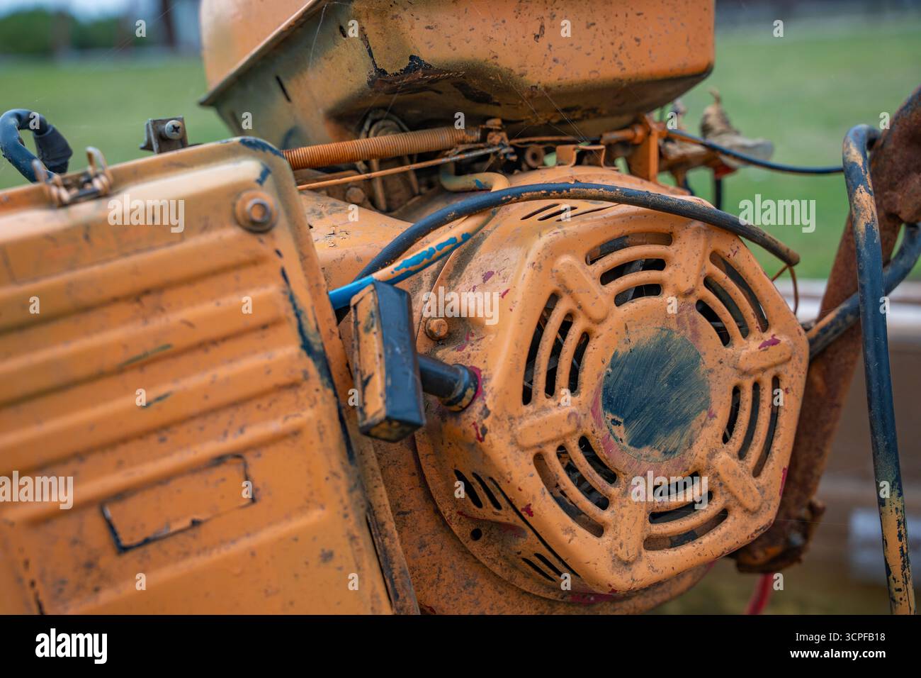 Old dirty rusty generator engine with cooling fan and mechanical parts ...