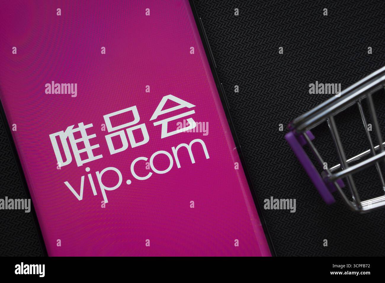 Dhaka, Bangladesh- 03 July 2025: A smartphone displaying the vip.com logo next to a miniature ...