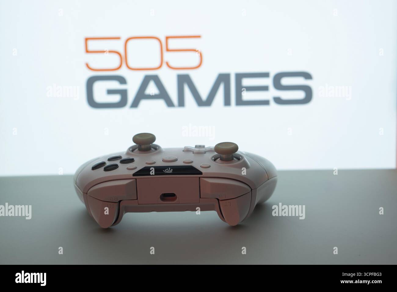 Dhaka, Bangladesh- 23 Sep 2025: Game controller in front of 505 Games ...