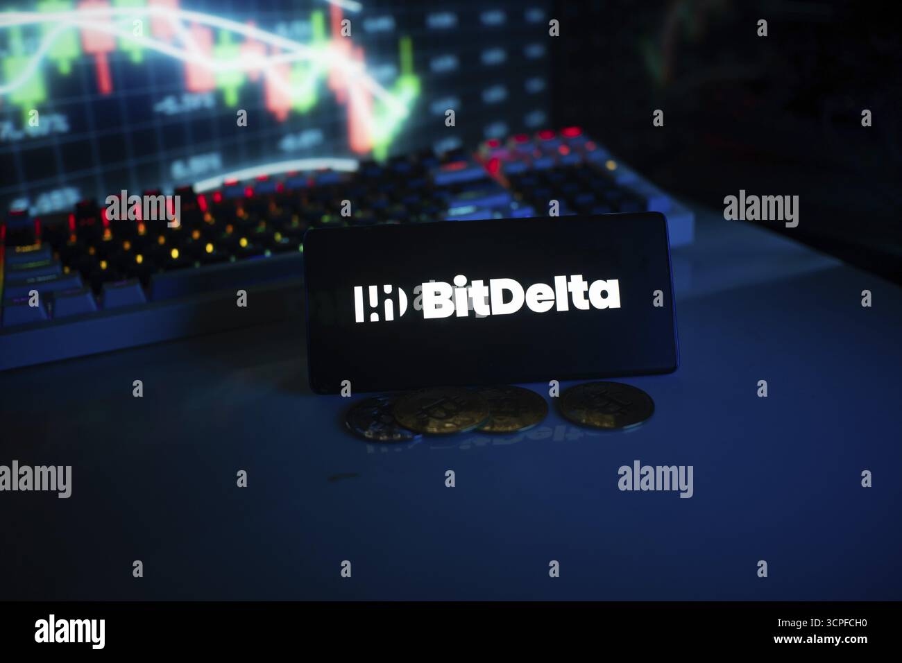 Dim-lit BitDelta logo on a phone with trading graphs and coins visible ...