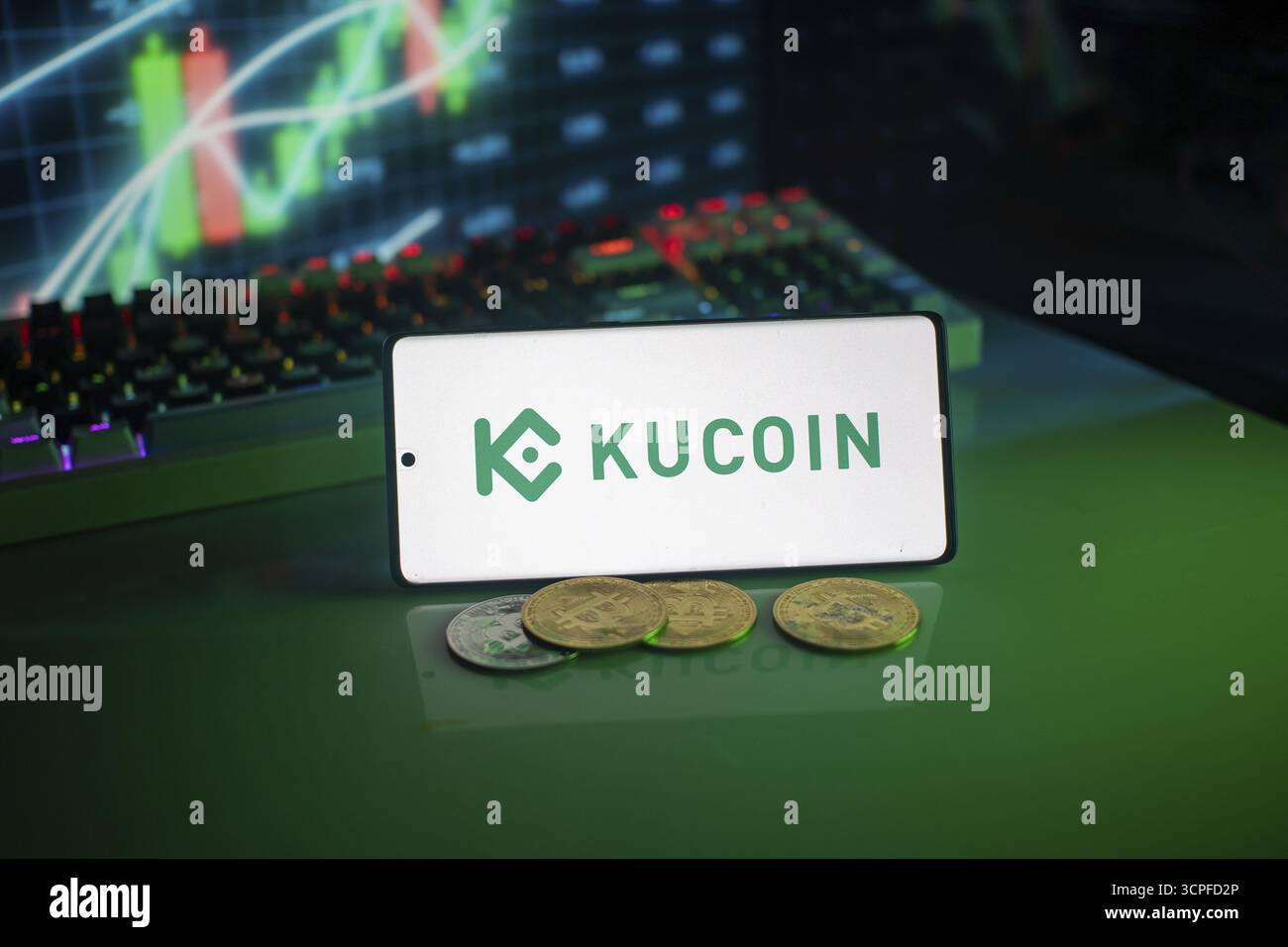 KuCoin logo on smartphone with coins, green neon lights, and trading ...