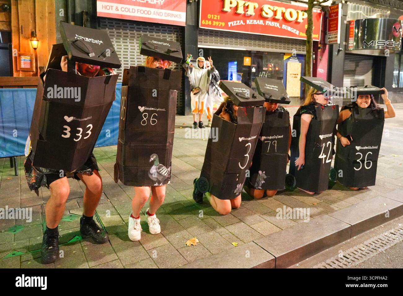 Broad Street, Birmingham, 25th September 2025 - Students wear wheelie ...