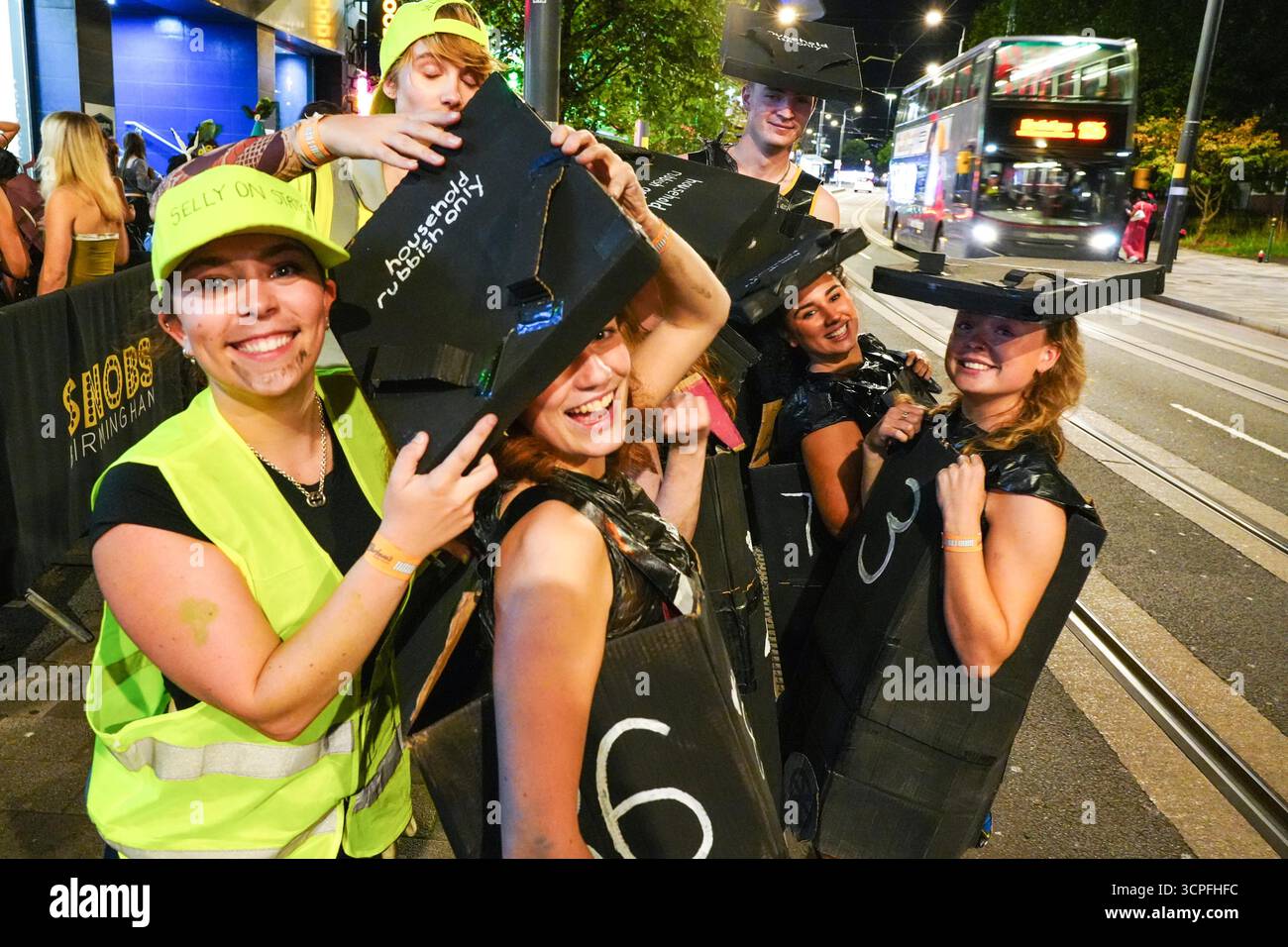 Broad Street, Birmingham, 25th September 2025 - Students wear wheelie ...