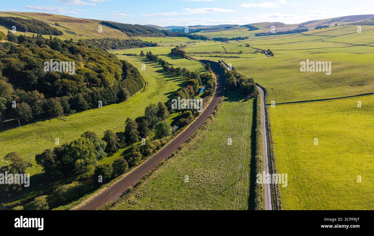 Aerial drone view of the Borders railway line at Stow village, Borders ...
