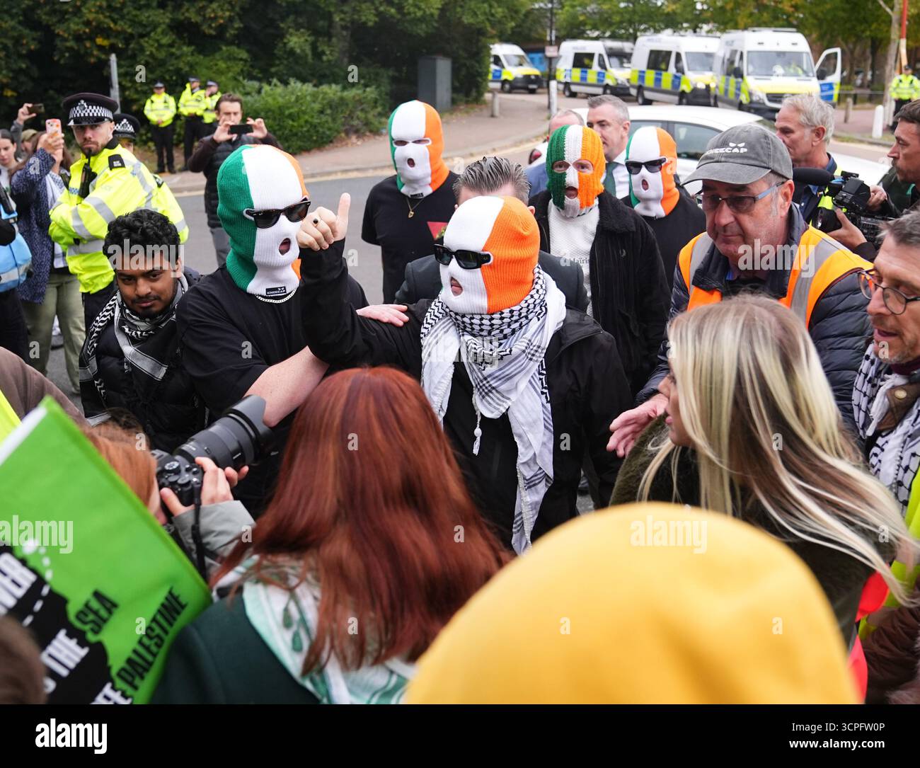 Kneecap's Liam Og O hAnnaidh (Mo Chara) (centre) gestures to supporters ...