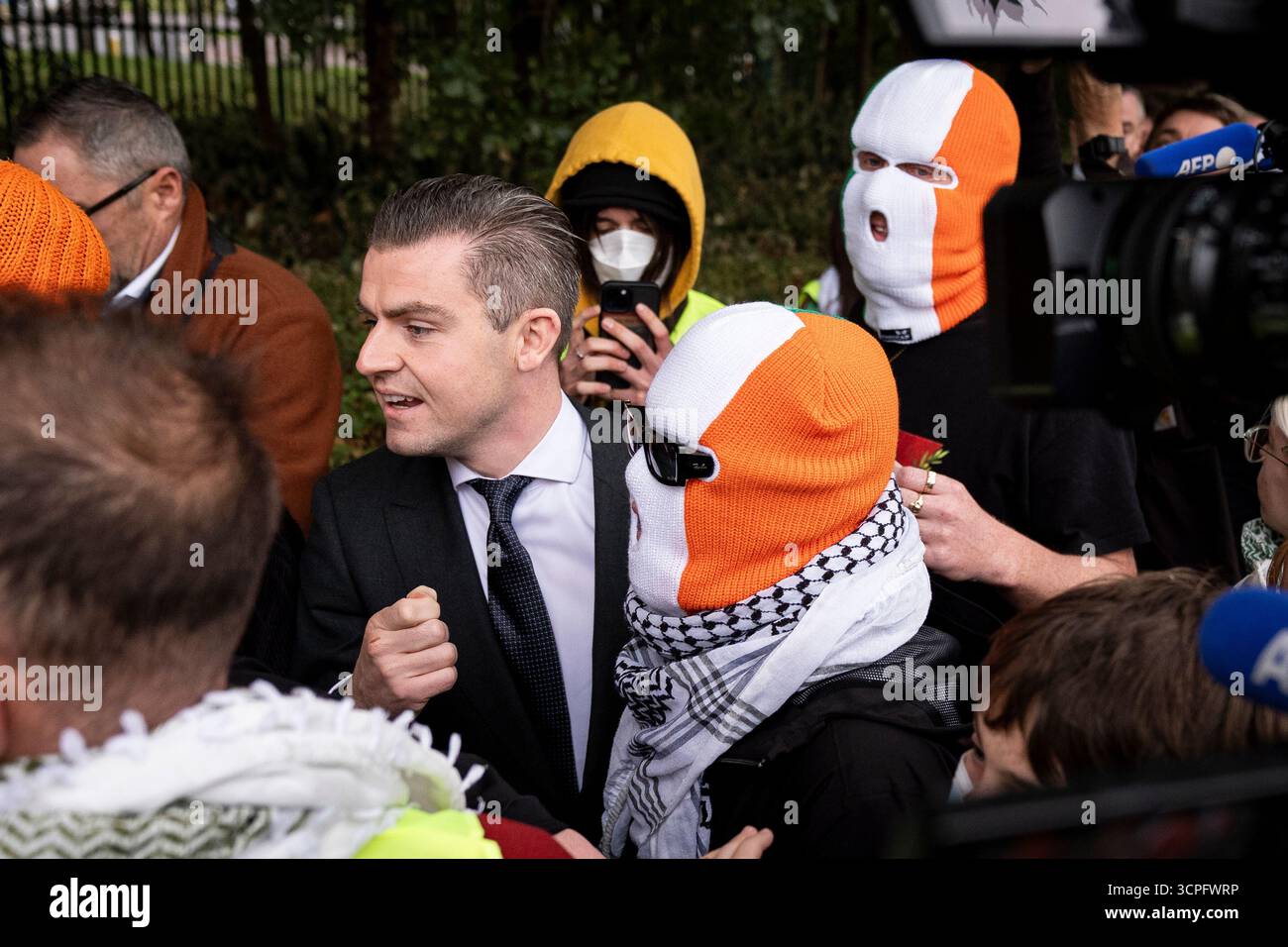 Kneecap's Liam Og O hAnnaidh (right)with his lawyer Darragh Mackin ...