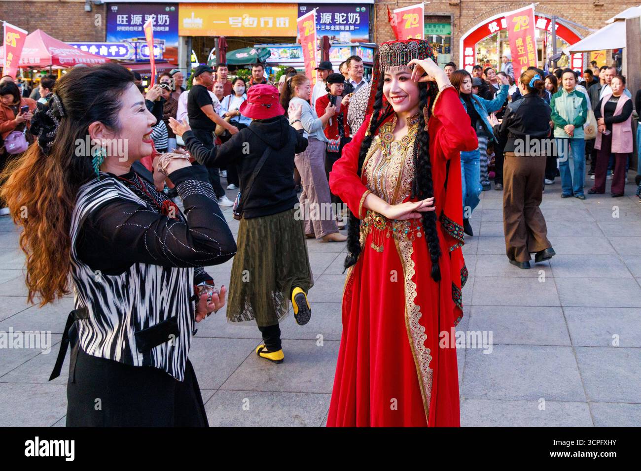 Tourists visit the Grand Bazaar in Urumqi City, northwest China's ...