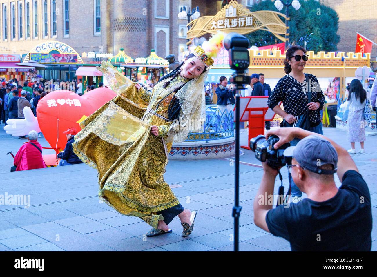 Tourists visit the Grand Bazaar in Urumqi City, northwest China's ...