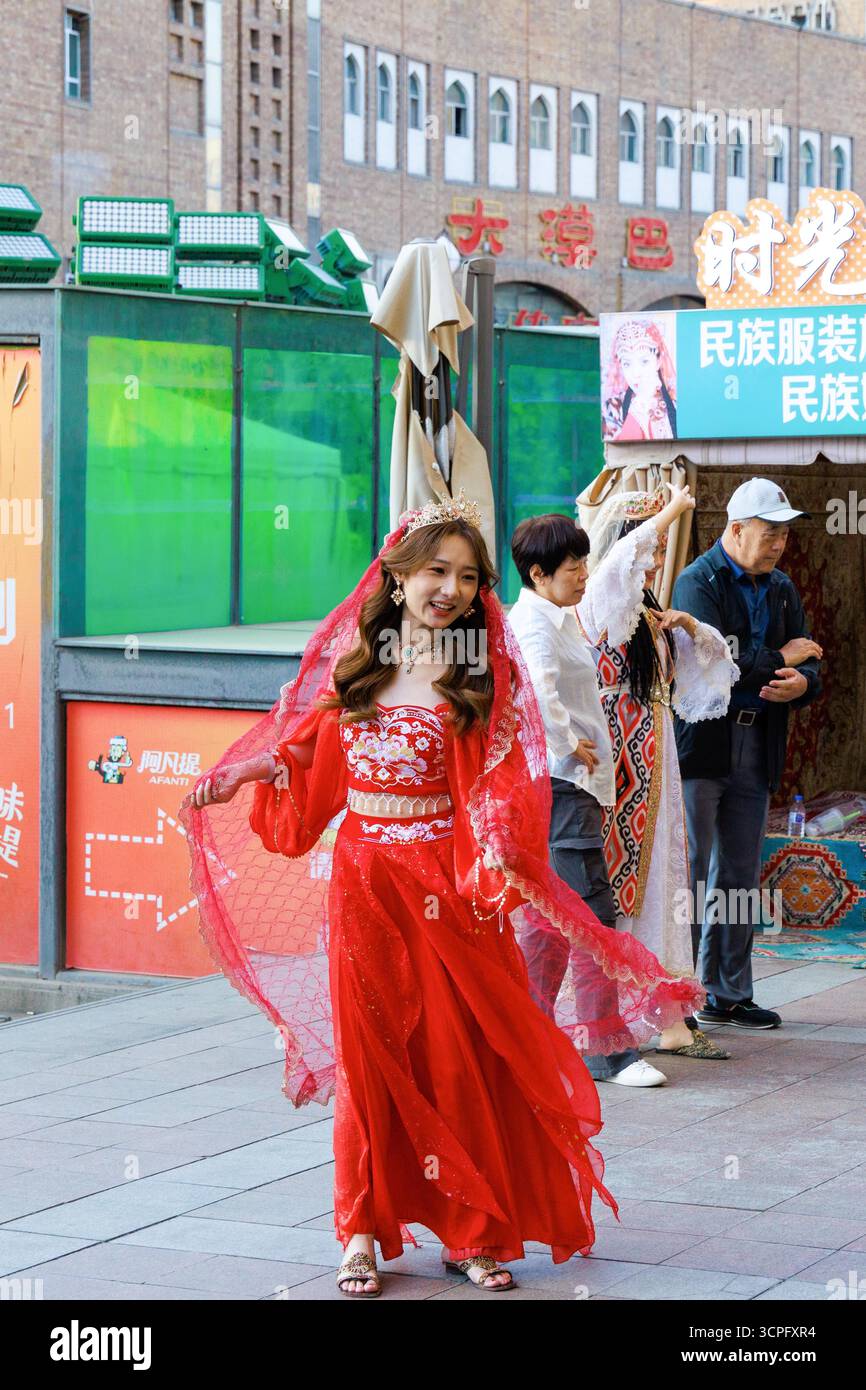 Tourists visit the Grand Bazaar in Urumqi City, northwest China's ...