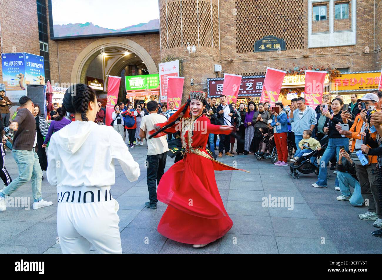 Tourists visit the Grand Bazaar in Urumqi City, northwest China's ...