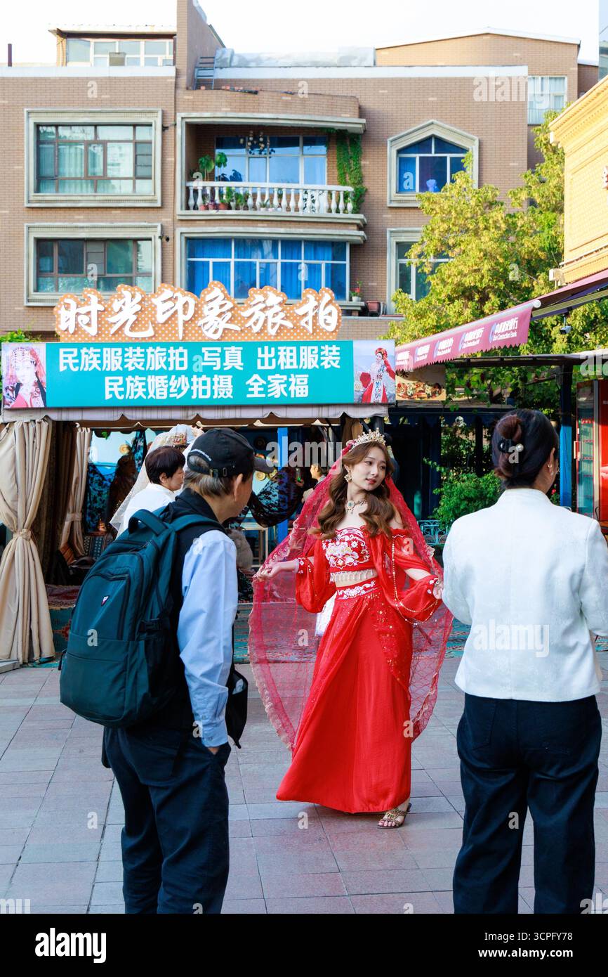 Tourists visit the Grand Bazaar in Urumqi City, northwest China's ...