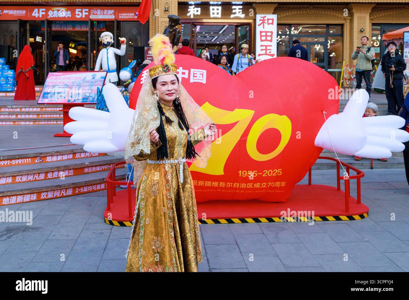 Tourists visit the Grand Bazaar in Urumqi City, northwest China's ...