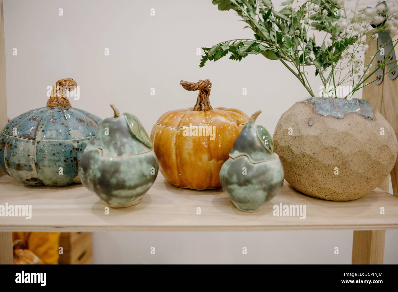A set of decorative clay gourds with a twisted stem Stock Photo - Alamy