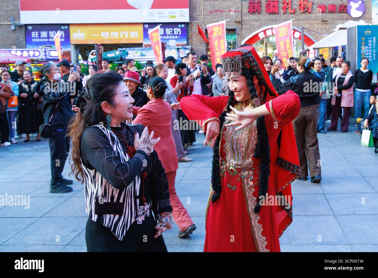 Tourists visit the Grand Bazaar in Urumqi City, northwest China's ...