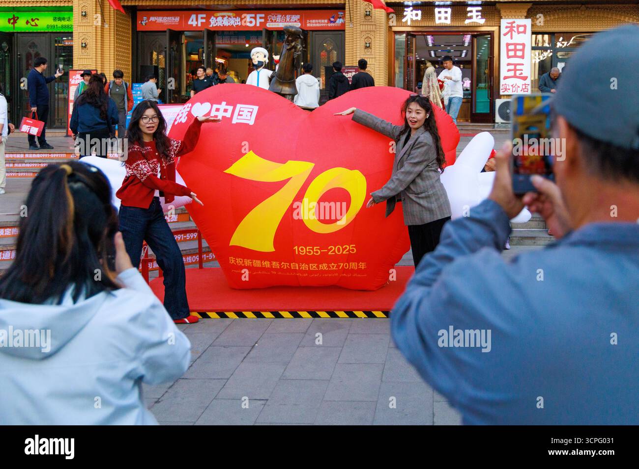 Tourists visit the Grand Bazaar in Urumqi City, northwest China's ...