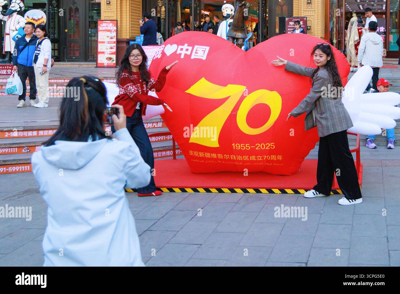 Tourists visit the Grand Bazaar in Urumqi City, northwest China's ...