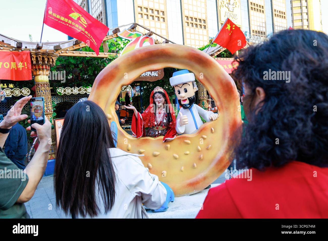 Tourists visit the Grand Bazaar in Urumqi City, northwest China's ...
