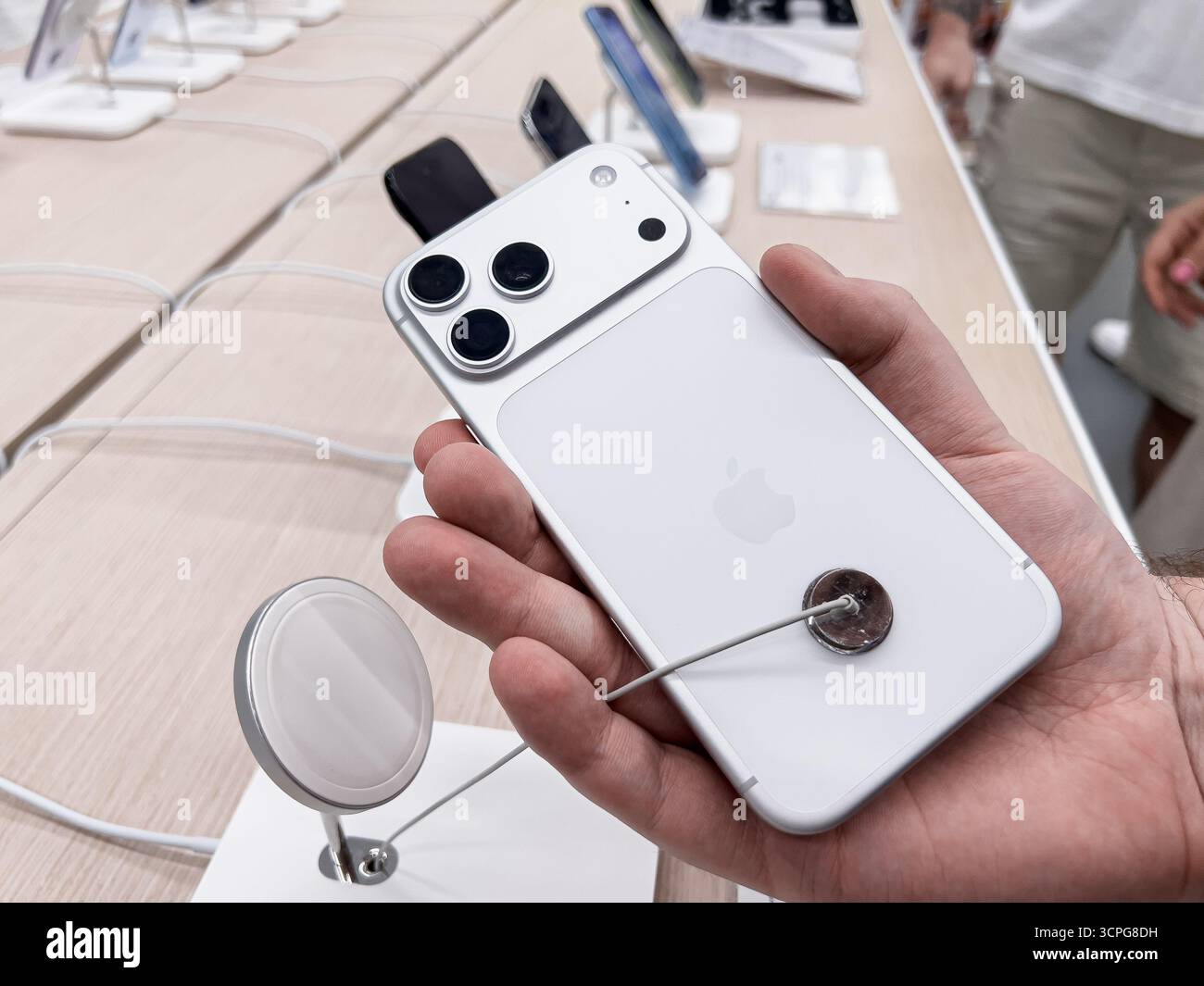 Poznan, Poland - September 20, 2025: Customer examines iPhone 17 Pro ...