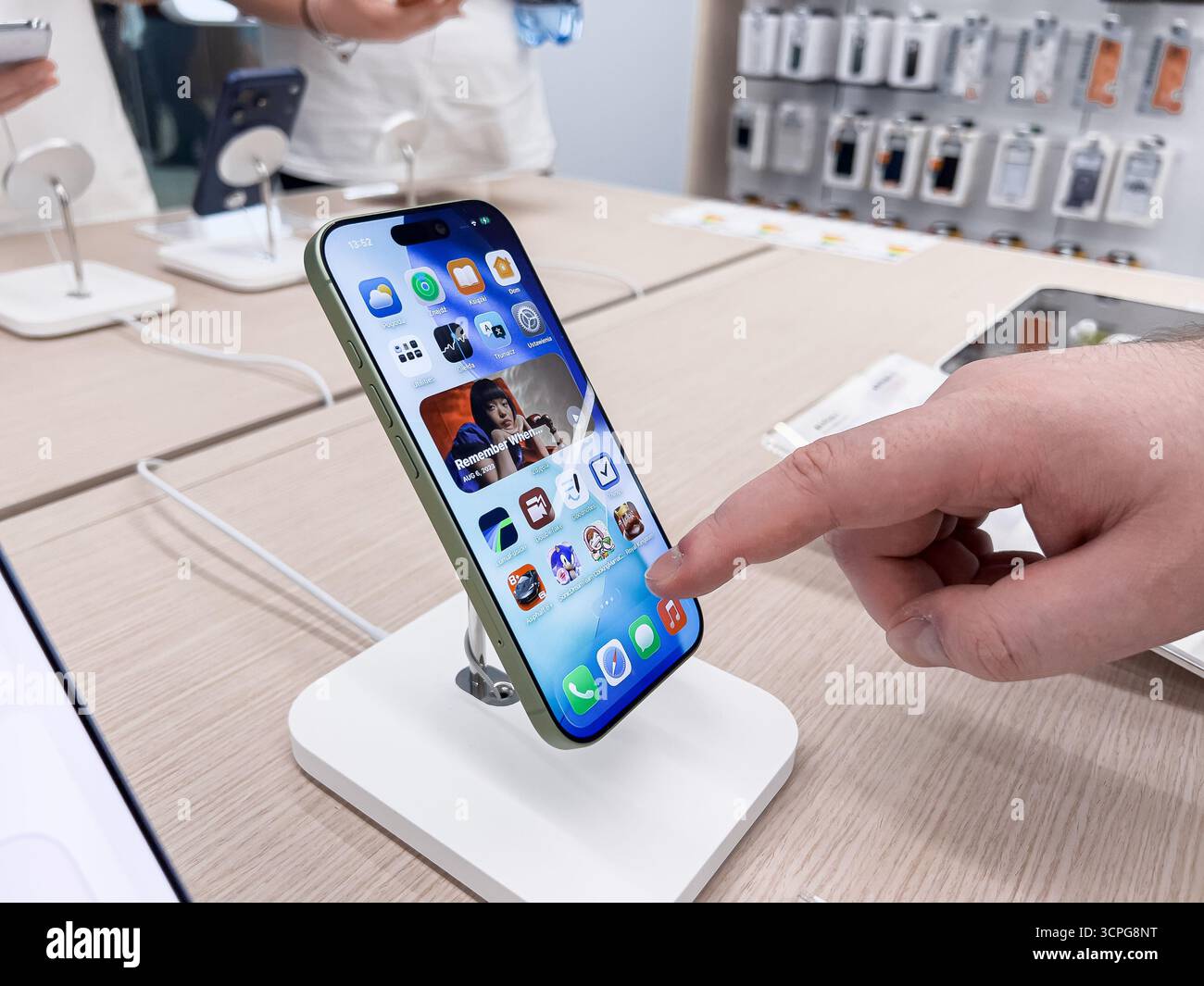 Poznan, Poland - September 20, 2025: iPhone 17 on display, hand touches ...