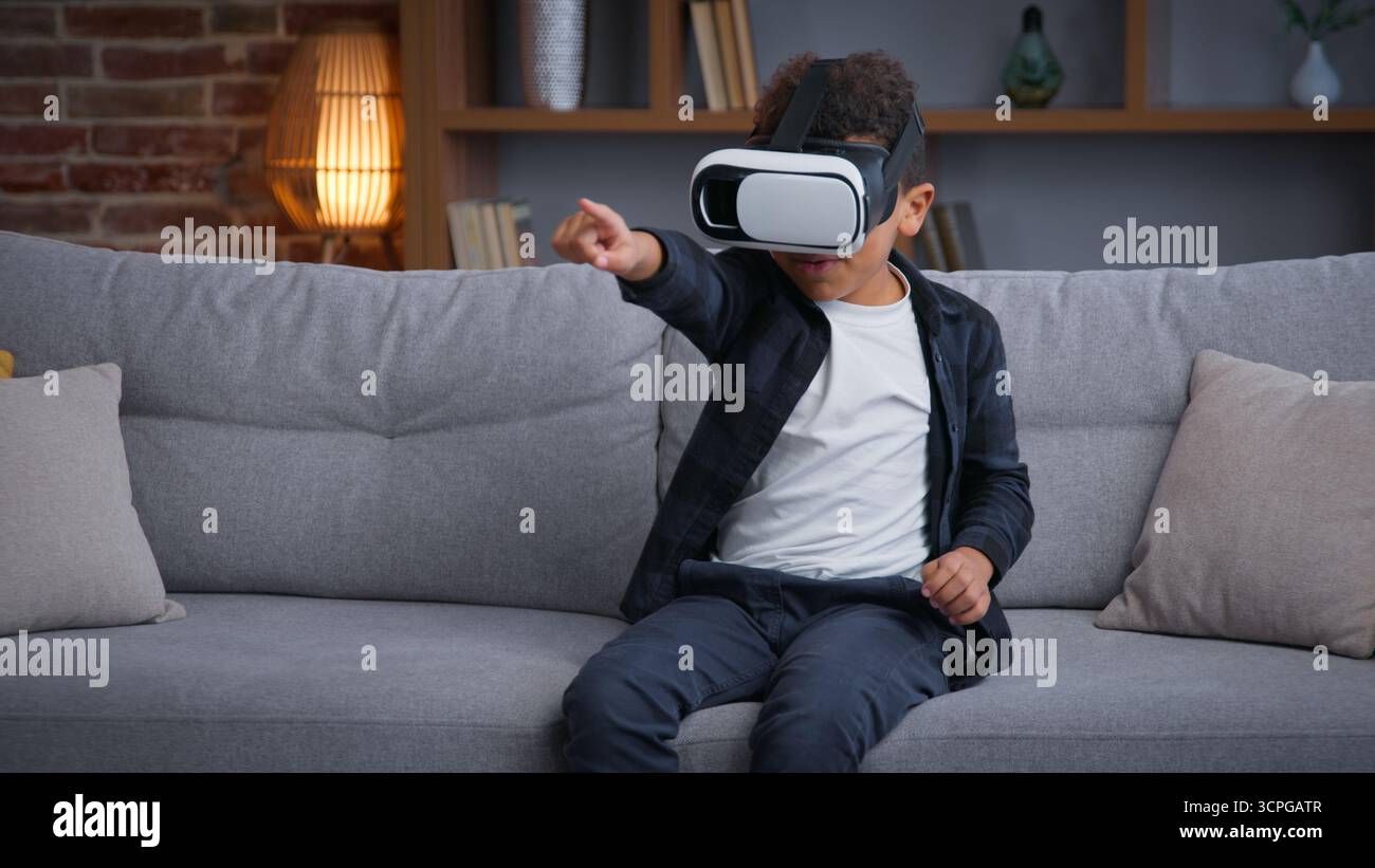 African American child boy kid son playing VR game at home play online ...
