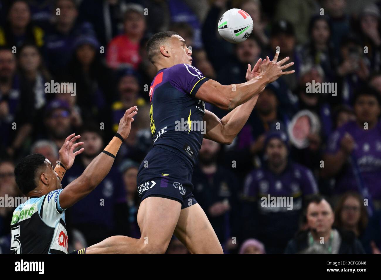 Will Warbrick of the Storm leaps for the ball during the NRL ...