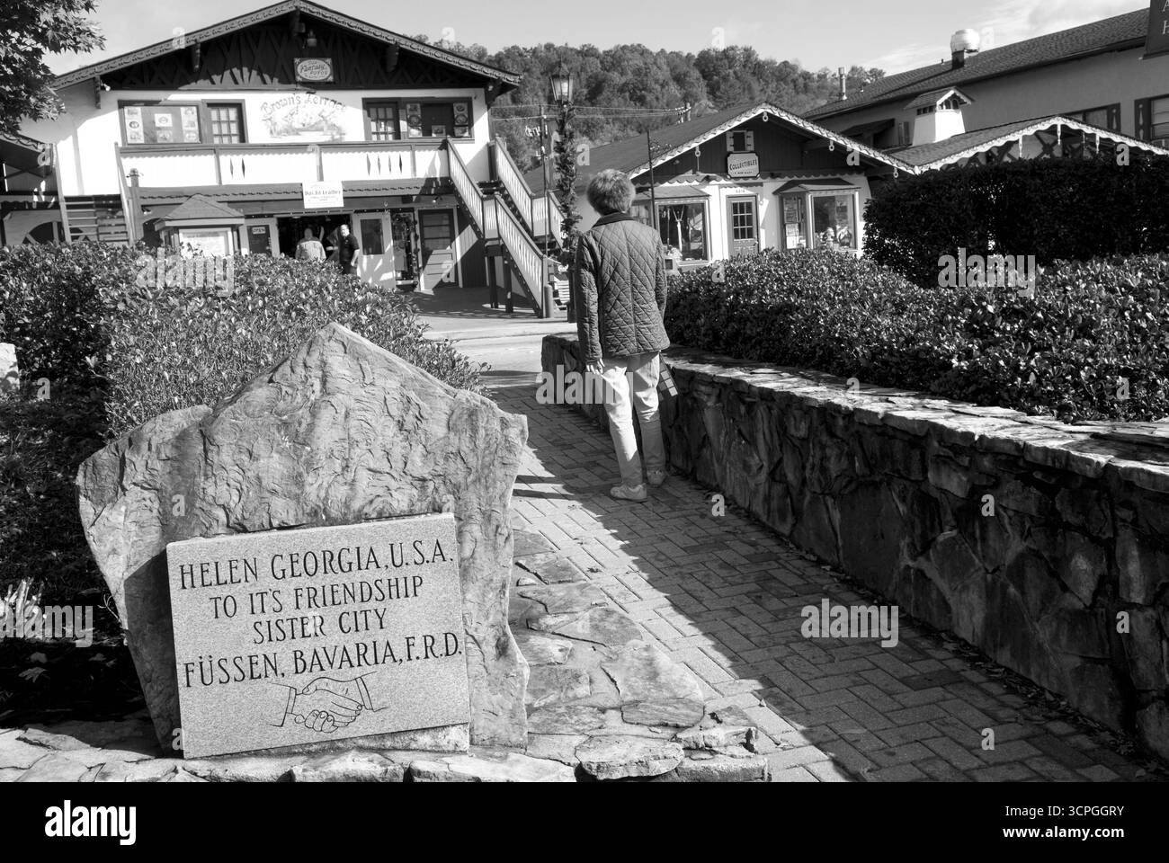 Tourist exploring a Bavarian-style alpine village in Helen, Georgia ...