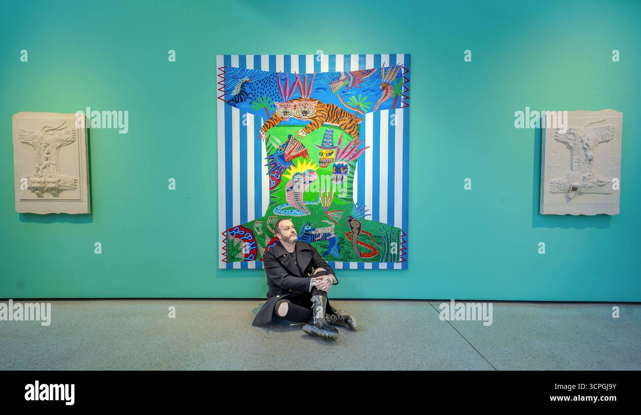 Artist Jordy Kerwick with his work, part of 'Jordy Kerwick: One To Give ...