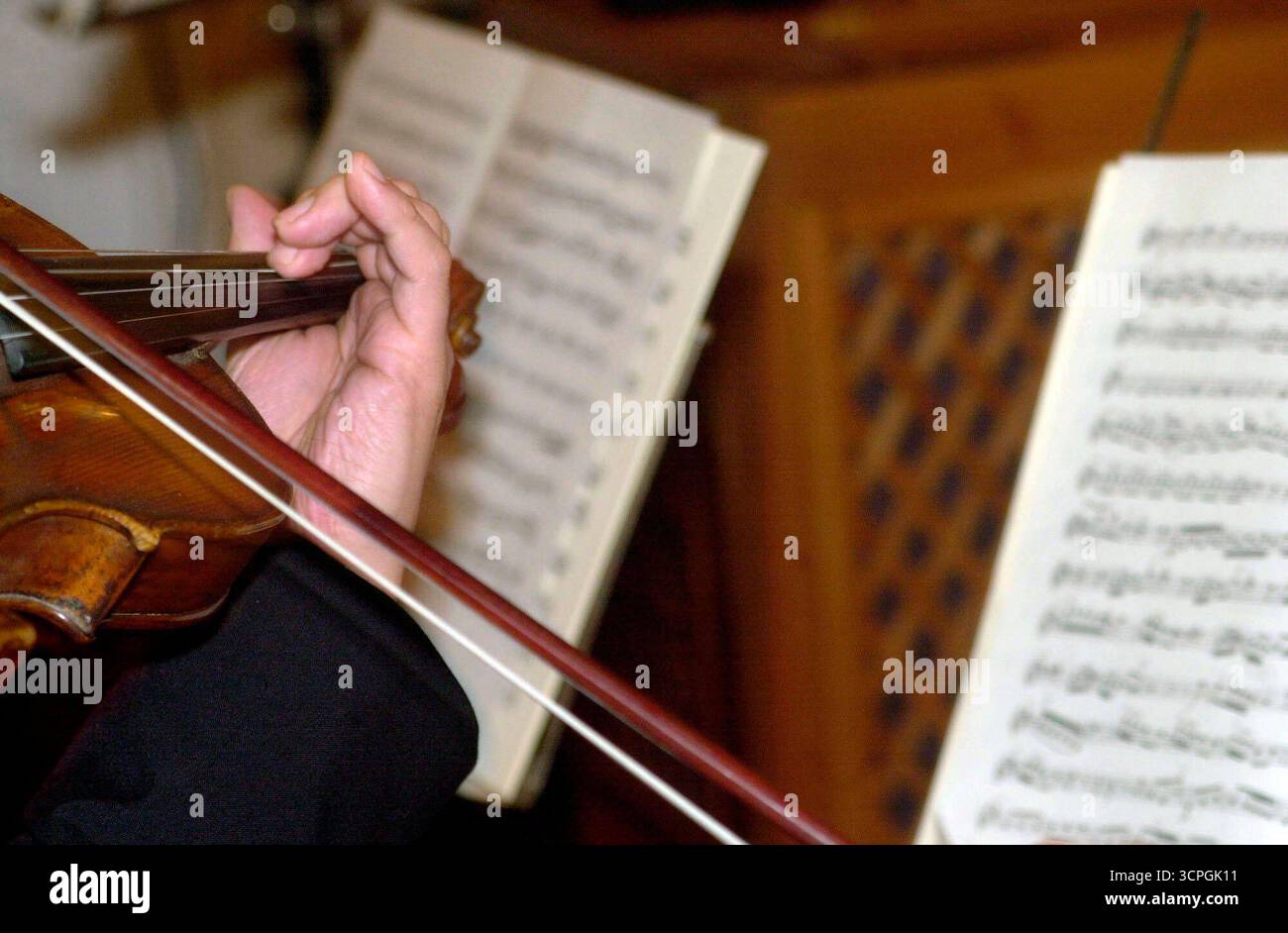 RECORD DATE NOT STATED a violinist with violin plays in an orchestra ...