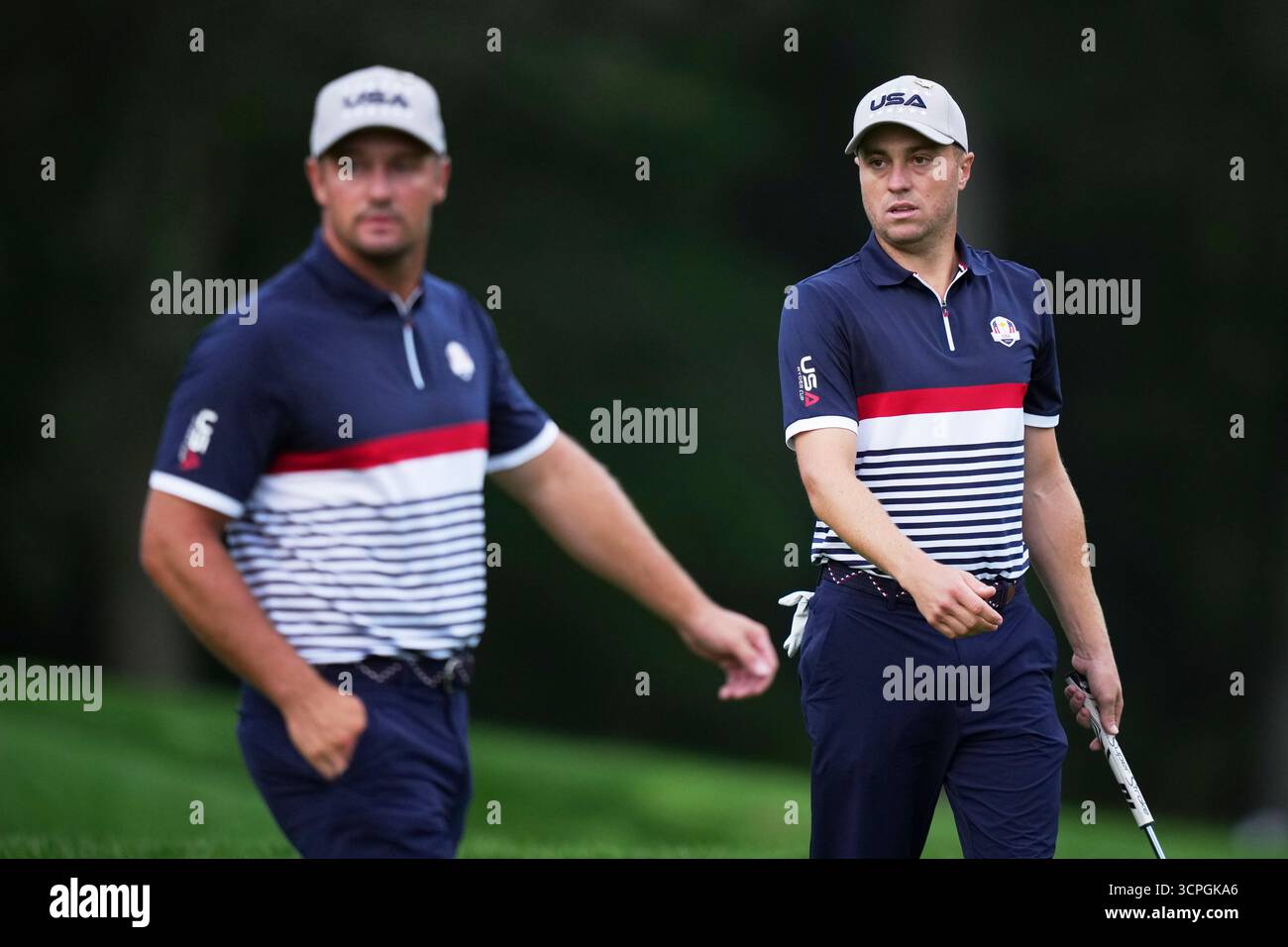 United States' Bryson DeChambeau and Justin Thomas walk on the second ...