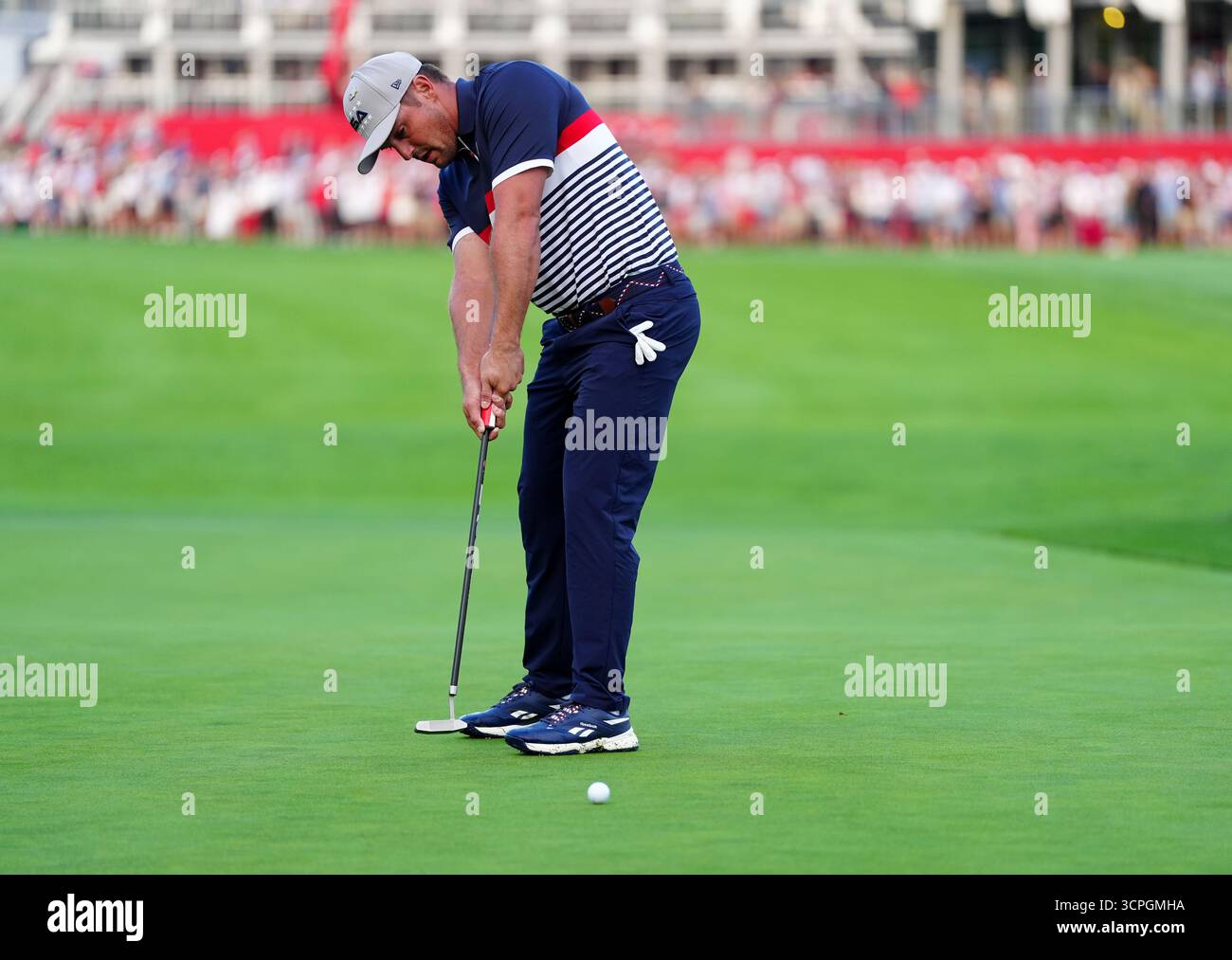 Bryson DeChambeau of Team United States putts on the 1st green during ...