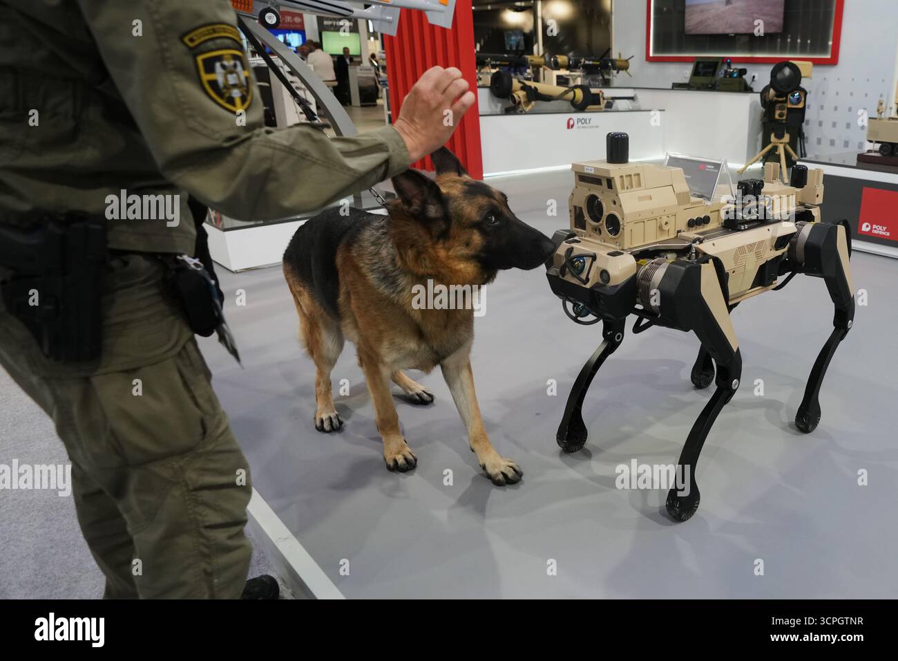 A Serbian army sniffer dog inspects the reconnaissance-attack quadruped ...