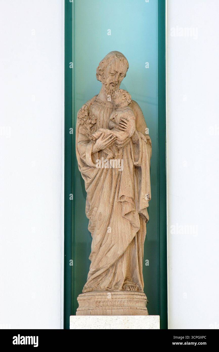 Saint Joseph with baby Jesus, statue in the Parish Church of the ...