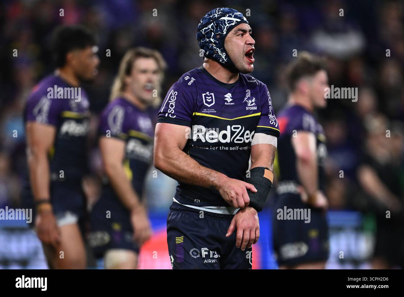 Jahrome Hughes of the Storm adjusts strapping on his arm during the NRL ...