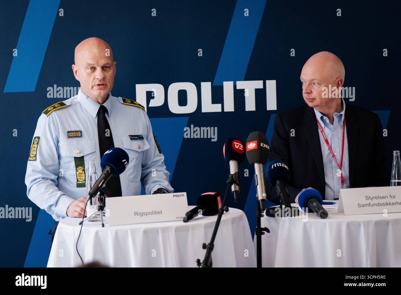 Peter Ekebjaerg from the National Police, left, and Henrik Brodersen ...