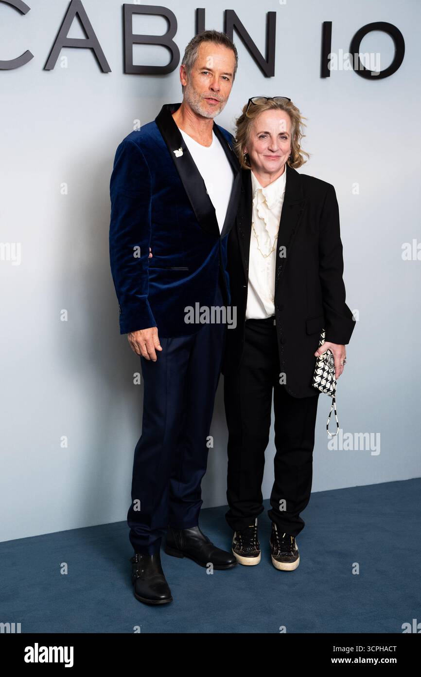 Guy Pearce and Debra Hayward pose for photographers upon arrival at the ...