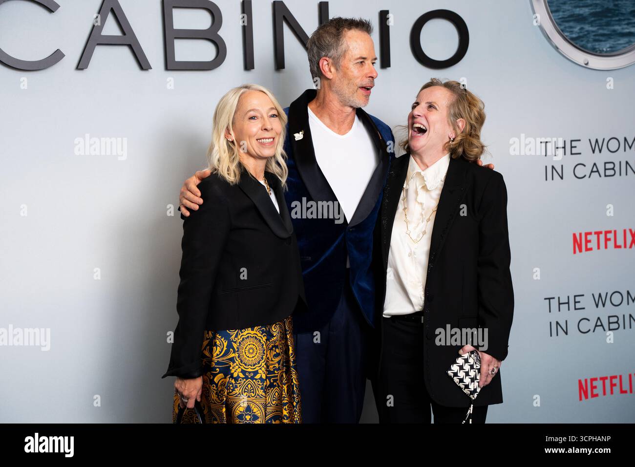 Jane Featherstone, left, Guy Pearce and Debra Hayward pose for ...